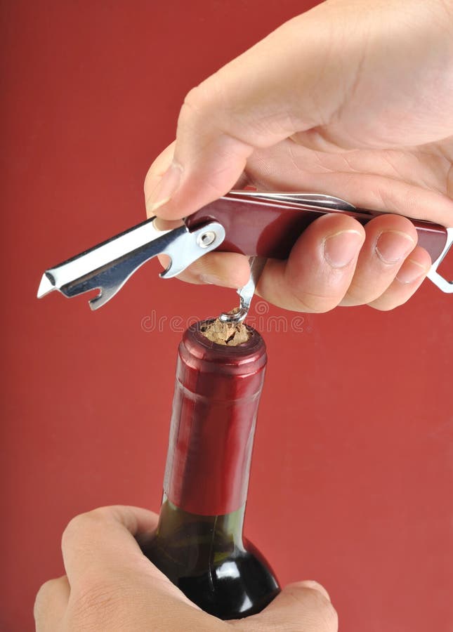Opening a wine bottle stock image. Image of open, booze - 11544969