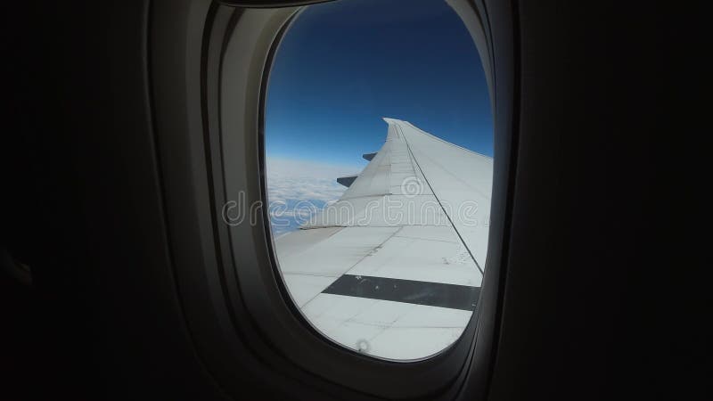 Opens the Window of the Airplane Window with a View of the Wing Stock ...
