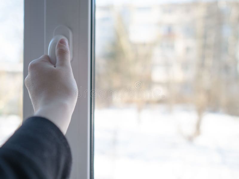 Opens the Window with His Hand To Ventilate the Room. White Window ...