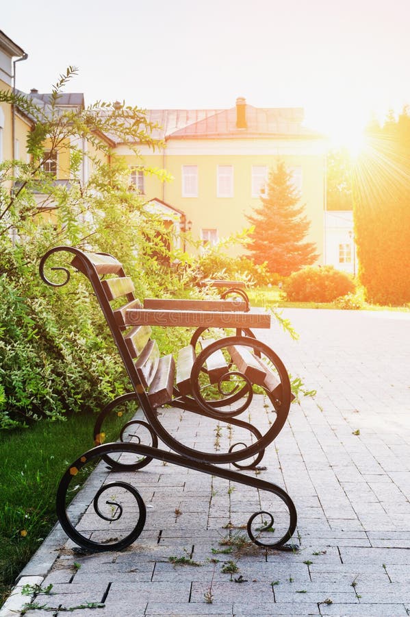 An Openwork Metal Bench in the Sunset Light. a Place of Rest and ...