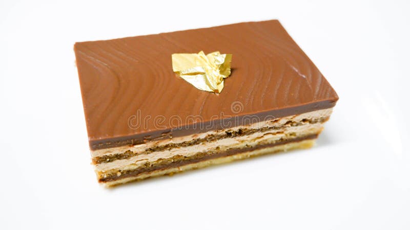 Opera cake on white plate stock photo. Image of homemade - 217000272