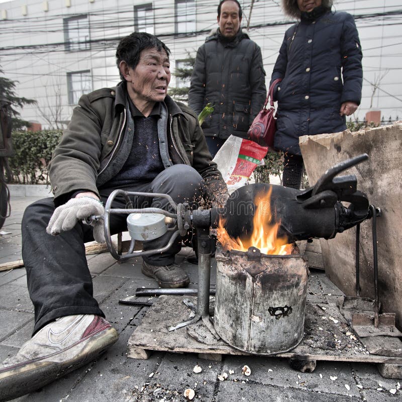 Operating a Chinese Corn Popper Editorial Stock Photo - Image of poor ...
