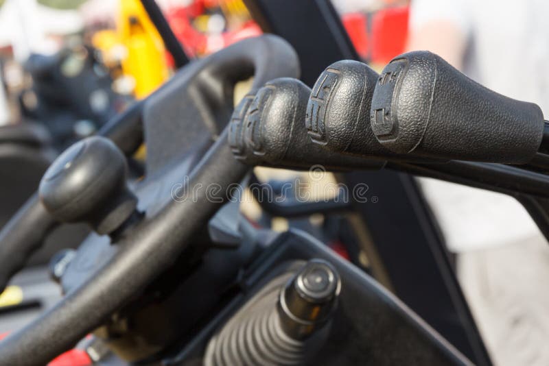 Steering Wheel and Operating Control Panels or Levers with Buttons in ...