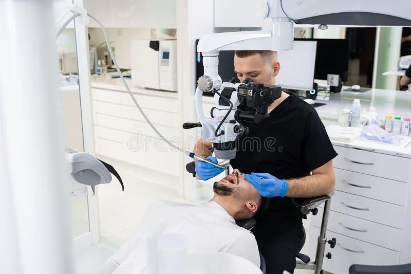 Operating Dental Digital Microscope Working Process. Dentist Uses ...