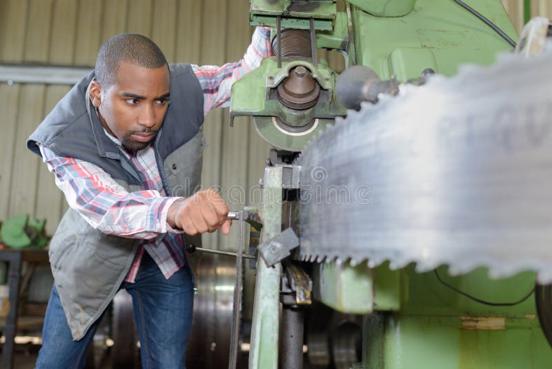 Operating a large saw stock photo. Image of labor, vocation - 122049236