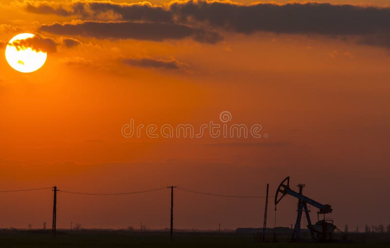 Operating Oil and Gas Well Contour, Outlined on Sunset Stock Image ...