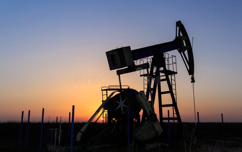 Operating Oil and Gas Well Well Profiled on Sunset Sky Stock Image ...