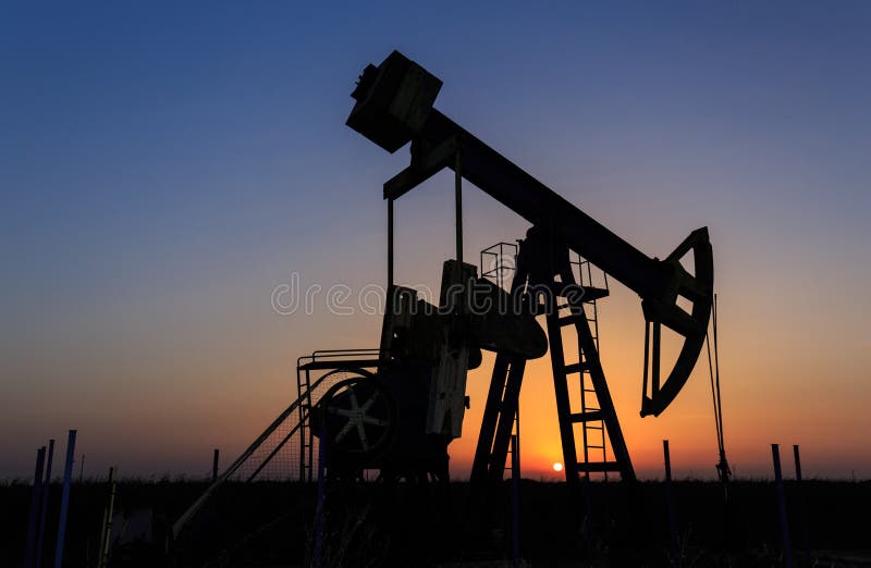 Operating Oil and Gas Well Well Profiled on Sunset Sky Stock Photo ...