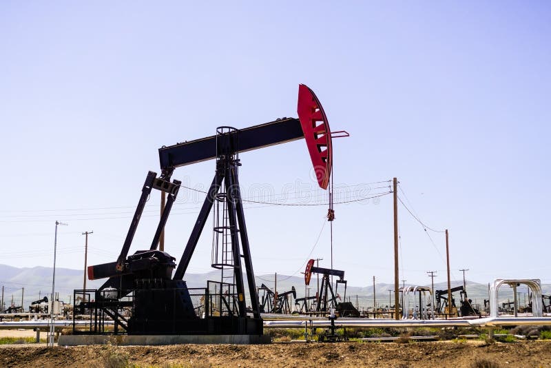 Operating Oil And Gas Well Profiled On Cloudy Sky Stock Photo - Image ...