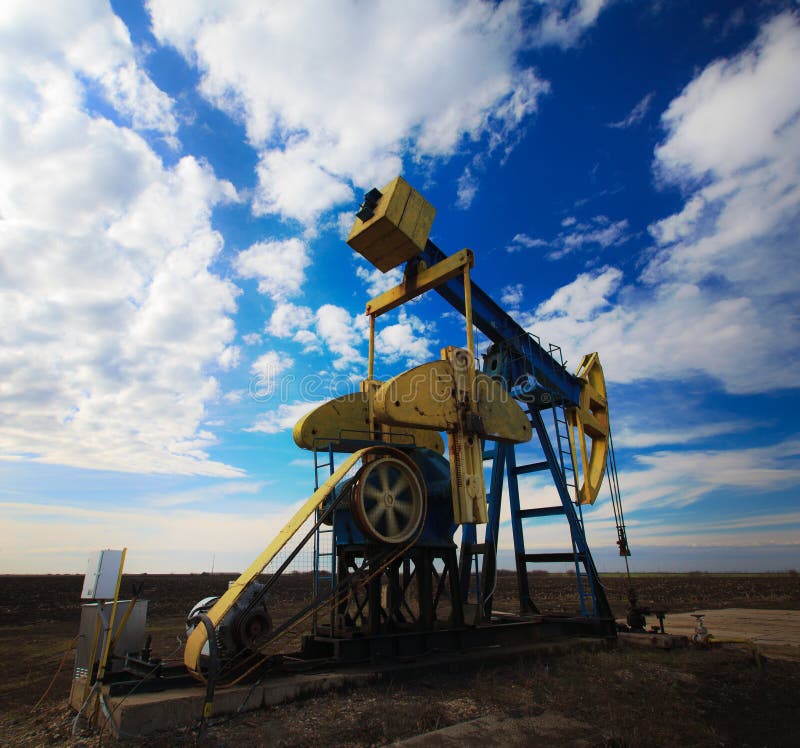 Operating Oil Well Profiled on Dramatic Cloudy Sky Stock Photo - Image ...