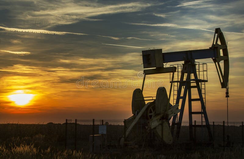 Operating Oil Well Profiled on Sunset Sky Stock Image - Image of ...