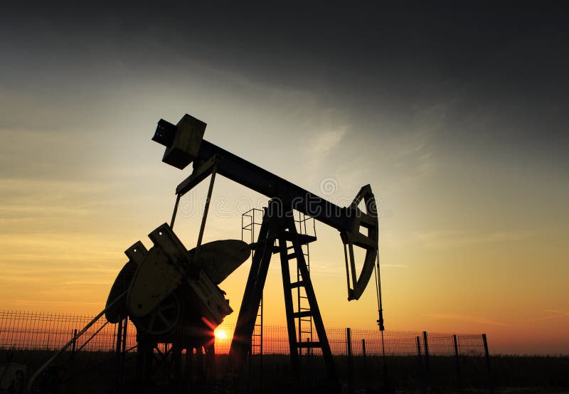 Operating Oil Well Profiled on Sunset Sky Stock Photo - Image of global ...