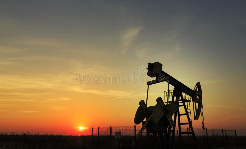 Operating Oil Well Profiled on Sunset Sky Stock Photo - Image of global ...