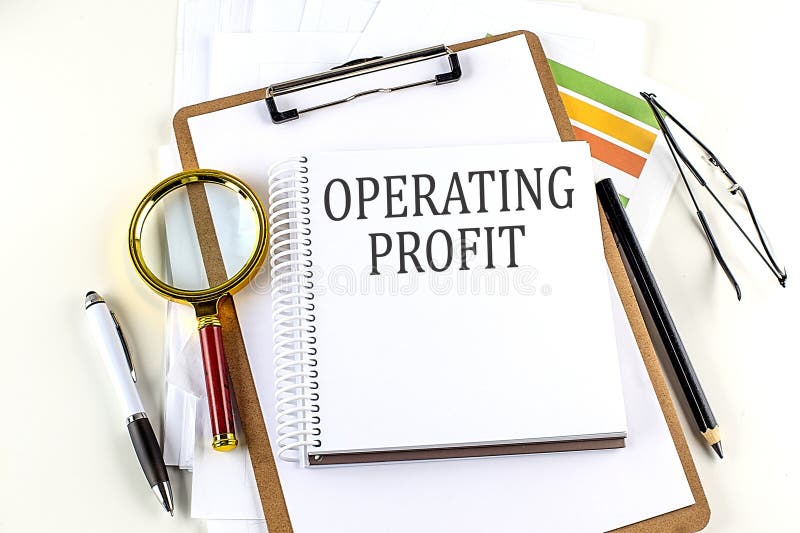 OPERATING PROFIT Text on Notebook with Clipboard on White Background ...