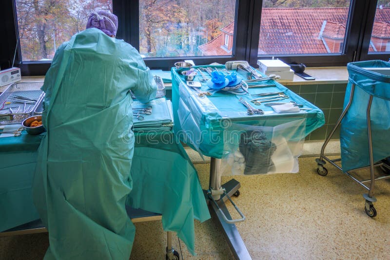 An Operating Room Nurse Prepares Instruments for an Operation Stock ...