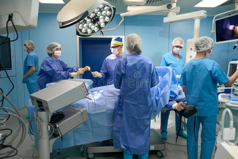 Operating Room, Teamwork Doctors, Anesthesiologist, Assistants and ...