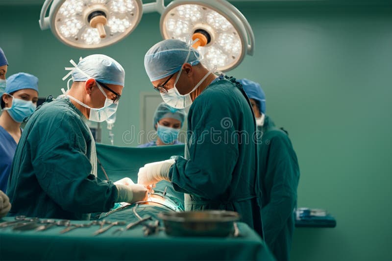 Operating Theatre Environment, Doctors and Team Operating on a Patient ...