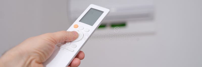 Operation of the Air Conditioner from Remote Control in Hand Stock ...