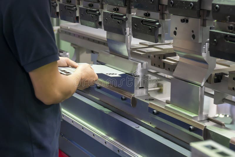 The Operation of Hydraulic Bending Machine with Technician. Stock Photo ...
