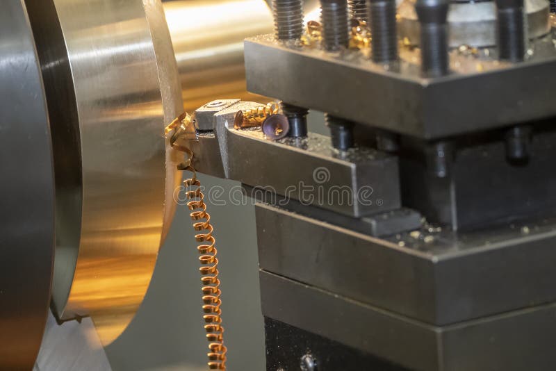 The Operation of Lathe Machine Cutting the Brass Shaft Parts with the ...