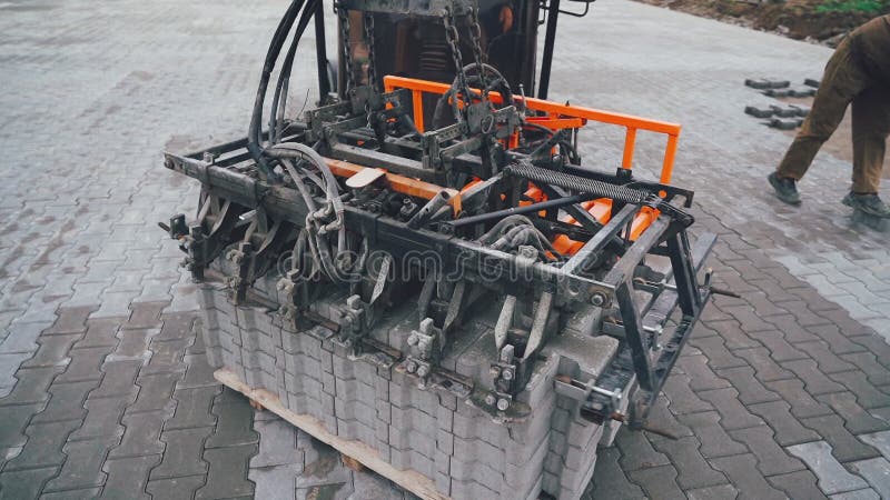 Operation of the Machine for Automatic Installation of Paving. Stock ...