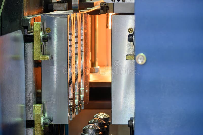 The Operation of Plastic Bottle Blow Mold Machine Stock Image - Image ...