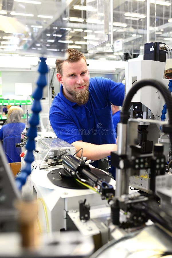 Operator Assembles Machine in a Factory - Production of Switch Cabinets ...