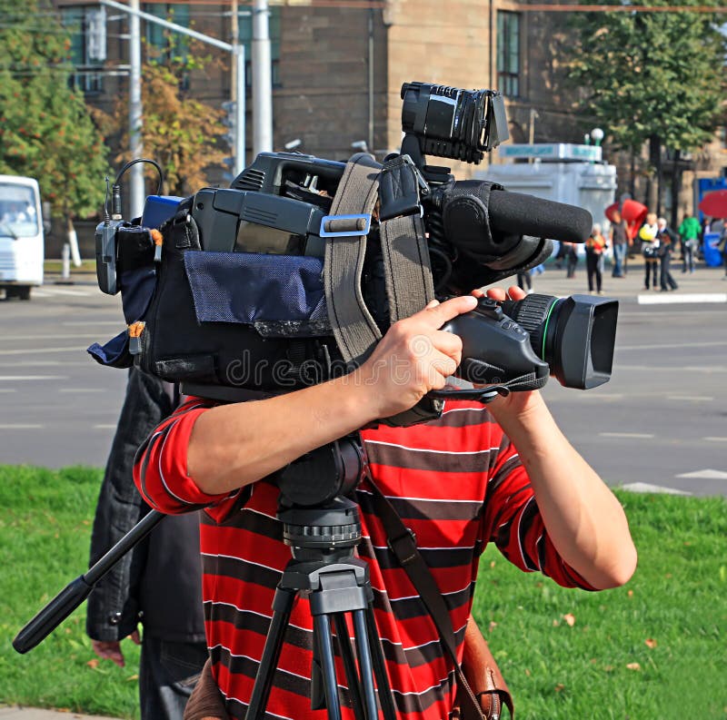Cameraman filming editorial stock photo. Image of microphone - 15911778