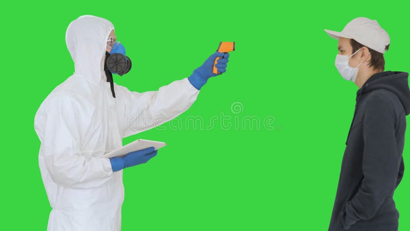 Operator Check Fever by Digital Thermometer on a Green Screen, Chroma ...
