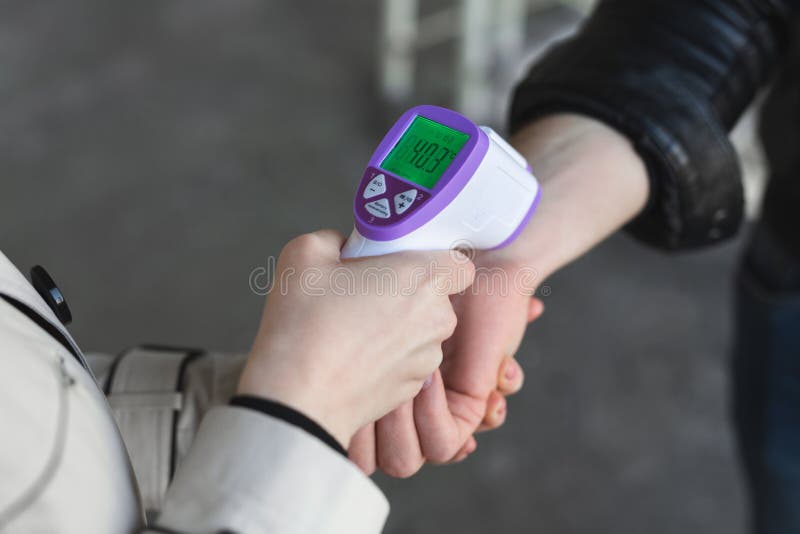 Check Fever by Digital Thermomiter Visitor at Information Counter for ...