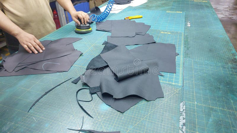 The Operator Cleans the Marker Pen Ink on the Surface Leather Stock ...