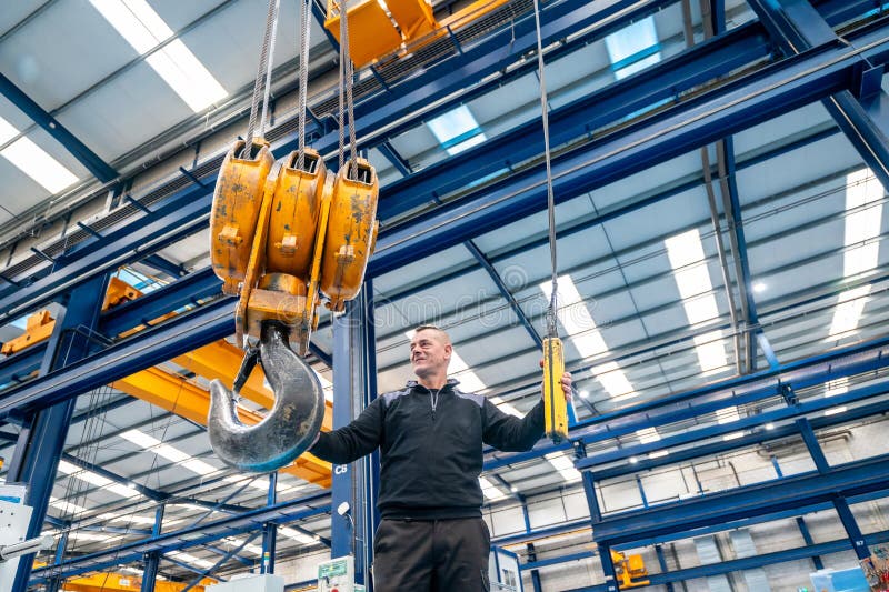 Operator Controlling a Industrial Crane in a Logistics Factory Stock ...
