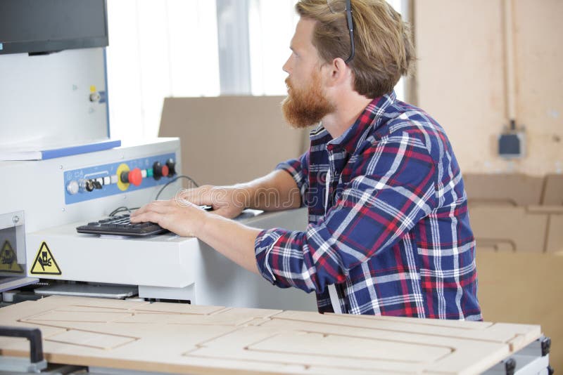 Operator Cutting Wood Using Special Machine Stock Image - Image of ...
