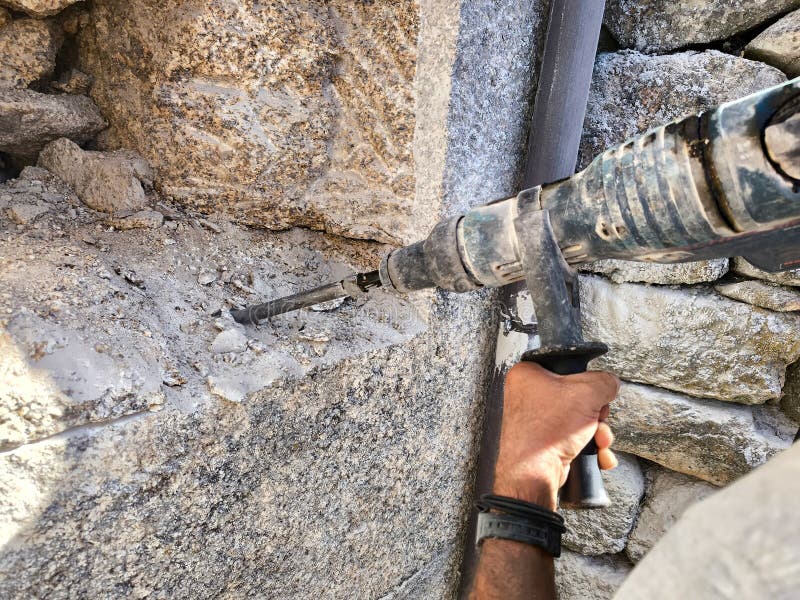 Operator Piercing Solid Rock with Impact Hammer Stock Image - Image of ...
