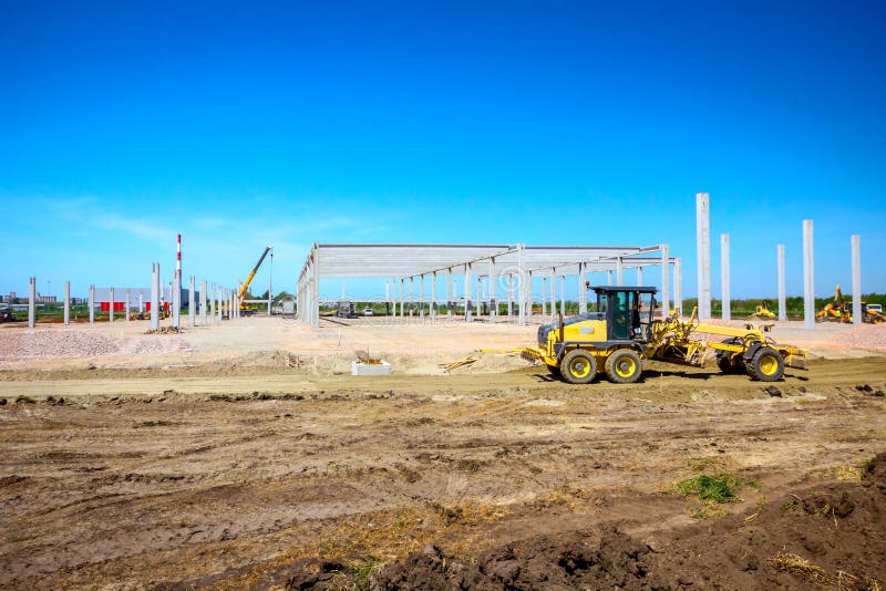 Grader is Leveling Ground at Construction Site Stock Photo - Image of ...