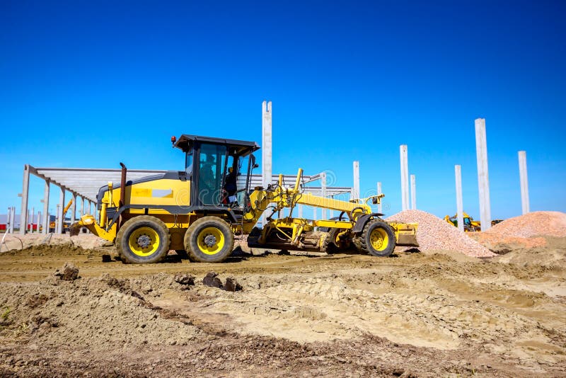 Grader is Leveling Ground at Construction Site Stock Image - Image of ...
