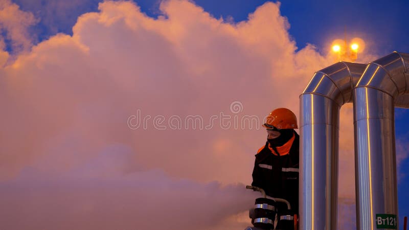 Operator in Heavy Industry Working through Night, Handling High-energy ...