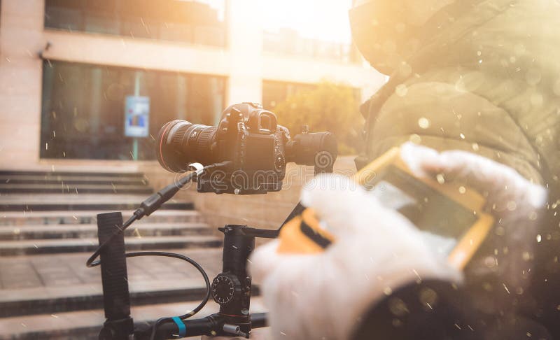 The Operator with His Video Camera Shoots, Hands Adjust the Camera ...
