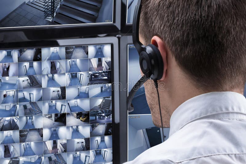 Sad Male Operator Looking at Graphs on Multiple Computer Screen Stock ...