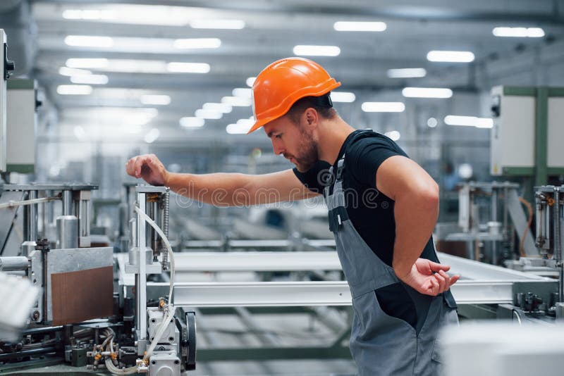 Operator of Machine. Industrial Worker Indoors in Factory Stock Image ...