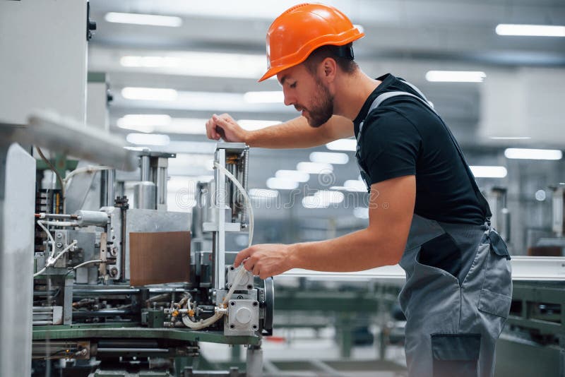 Operator of Machine. Industrial Worker Indoors in Factory Stock Image ...