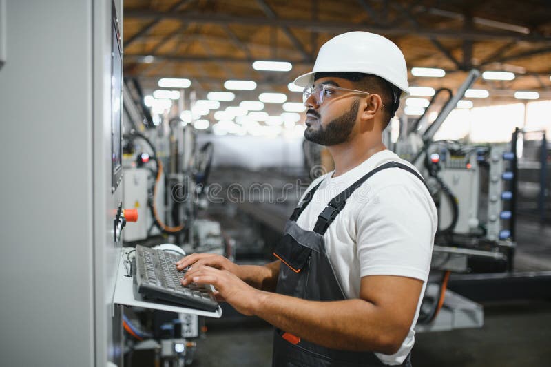 Operator of Machine. Industrial Worker Indoors in Factory Stock Photo ...