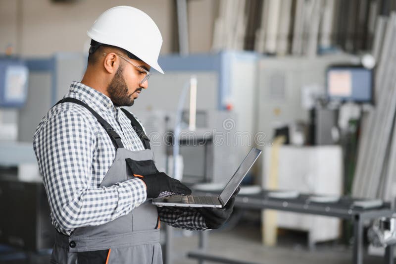 Operator of Machine. Industrial Worker Indoors in Factory Stock Photo ...