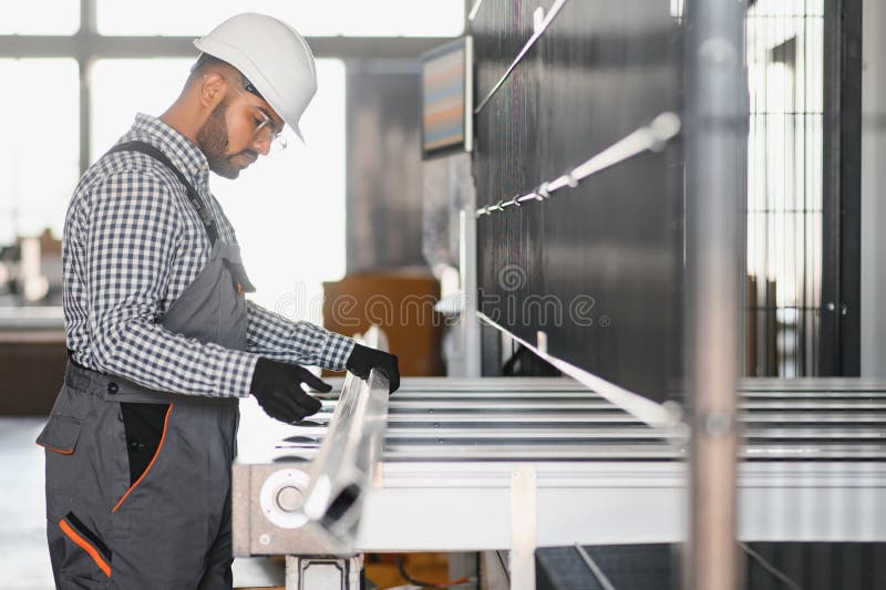 Operator of Machine. Industrial Worker Indoors in Factory Stock Image ...