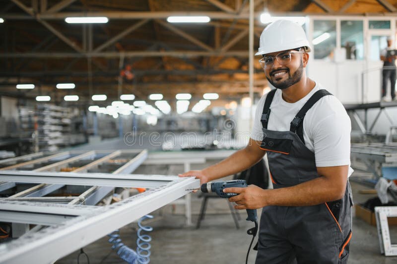 Operator of Machine. Industrial Worker Indoors in Factory Stock Photo ...