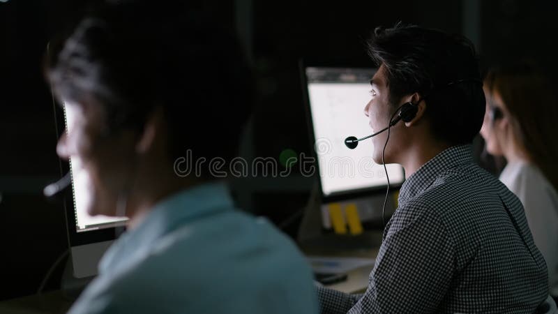 Operator Man Work Together with His Team To Support the Customer at ...