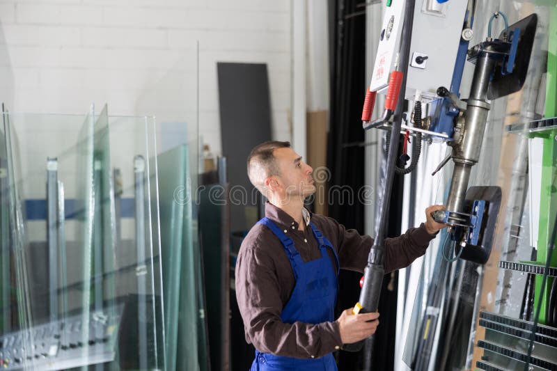 Operator Maneuvering Glass Sheets Vacuum Lifter Industrial Workshop ...