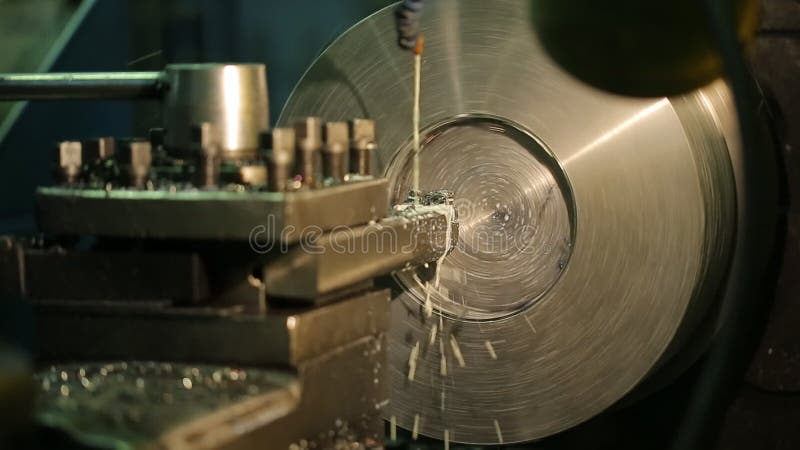 Running a Milling Machine with CNC and a Flow of Cutting Fluid. Stock ...