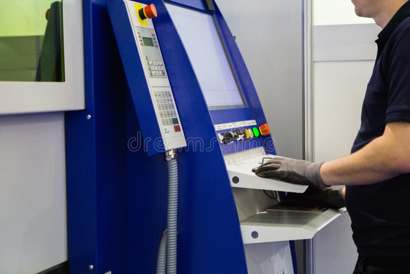 Operator Controls Machine for Cutting Metal. Stock Photo - Image of ...
