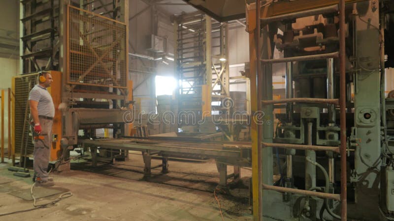 Operator Performing Quality Control on Metal Pieces Using a Micrometer ...